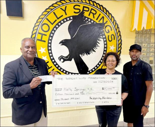 Partnership presents $15,000 check to Hawks | The South Reporter